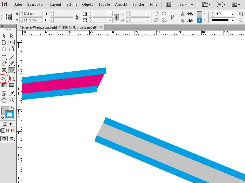 Use the scissors tool in Adobe InDesign